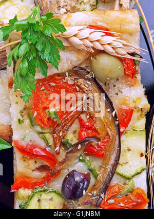 mixed organic vegetables vegetarian pizza on wood table Stock Photo - Alamy