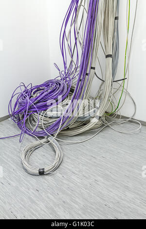 Ethernet cables hang from ceiling awaiting installation Stock Photo - Alamy