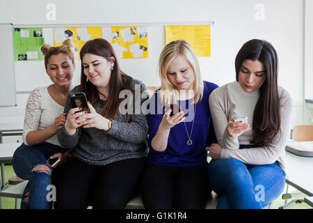 The head-down generation is on working with their smartphone Stock ...