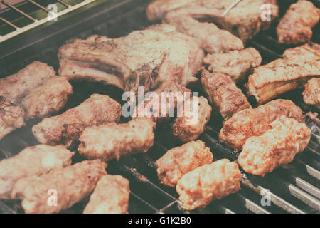 Traditional romanian barbecue with minced pork meat rolls (mici or ...