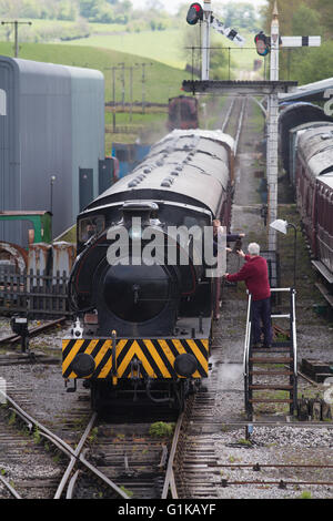 train driver and signalman exchange train token tokens Stock Photo - Alamy