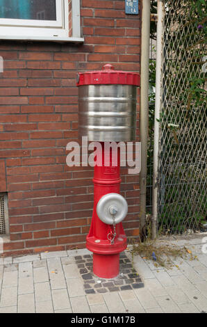 Red fire hydrant in a street in a german town Stock Photo - Alamy
