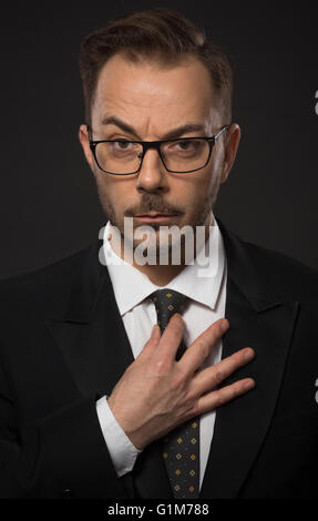 Businessman adjusting himself Stock Photo - Alamy