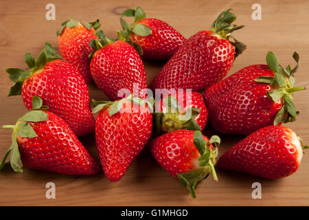 Ripe strawberries over wooden table background with copy space Stock ...