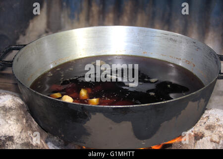 Cooking plantain on an open wood fire in the Dominican Republic Stock ...