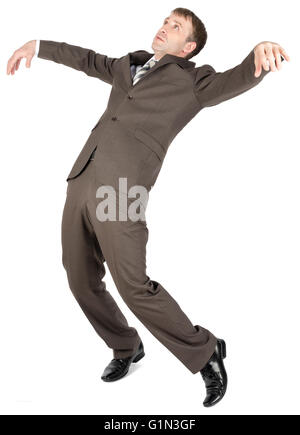 The frightened businessman in suit falling down and screaming against ...