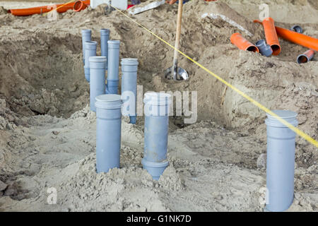 Set of waste pipes are assembled and lined up on building site Stock ...