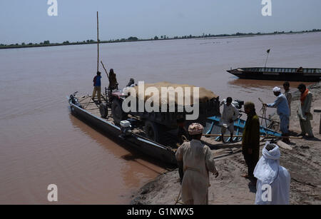 Pakistani farmers loading a tractor trolley loaded with watermelon on a ...