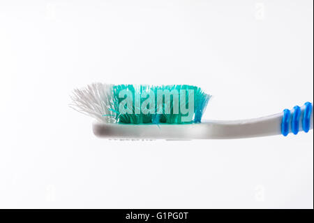 Old toothbrush with worn out bristles isolated macro Stock Photo - Alamy