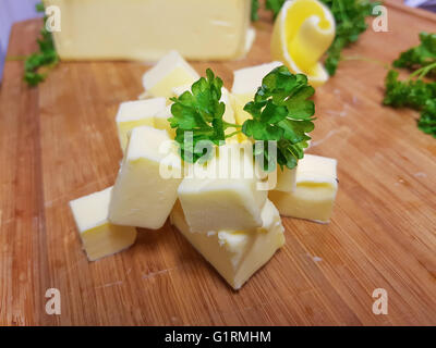 Cutting butter into cubes Stock Photo - Alamy