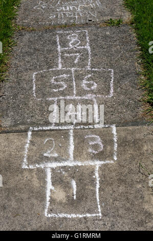 Hopscotch game drawn on sidewalk in chalk Stock Photo - Alamy