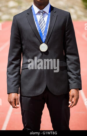 Young man wearing a gold medal Stock Photo - Alamy