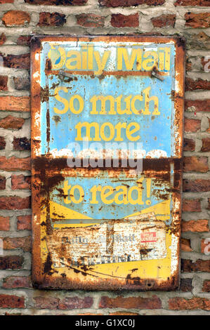An old Daily Mail advertising sign on a brick wall in Bamburgh ...