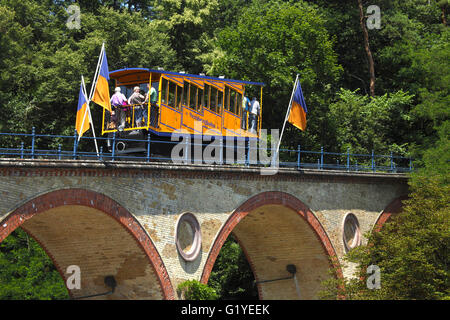 Waggon of Nerobergbahn drives over arch bridge, funicular ...