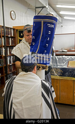 After a Torah reading and before it's returned to the Holy Ark, A ...