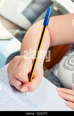 girl write on white paper close up Stock Photo - Alamy