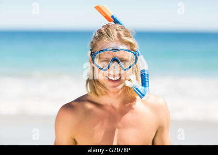 young man wearing a diving mask and a snorkel pretending he is Stock ...