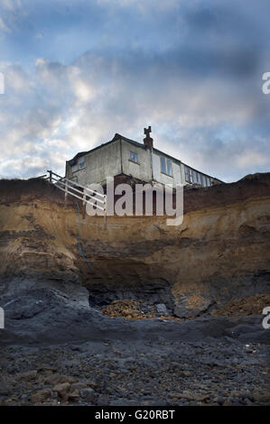 House on the cliff edge, Happisburgh Norfolk England UK Stock Photo - Alamy