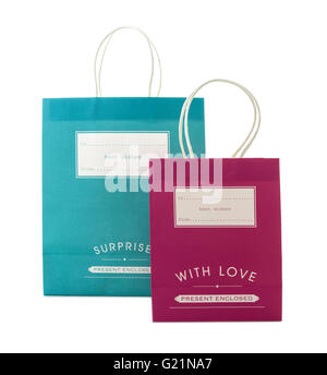 Three colorful gift bags cut out on white background Stock Photo - Alamy