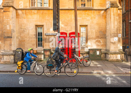 Family riding bikes in the city Stock Photo - Alamy