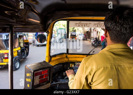 Inside an auto rickshaw in India looking through the front driver ...