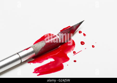 Scalpel with blood Stock Photo - Alamy
