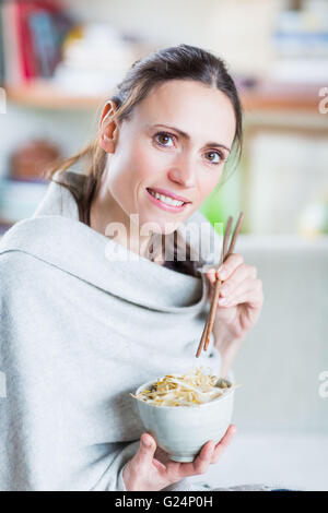 Woman eating sprouts Stock Photo - Alamy