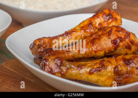 Rice and chicken on white plate Stock Photo - Alamy
