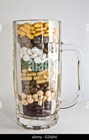 beer mug of drugs pills Stock Photo - Alamy