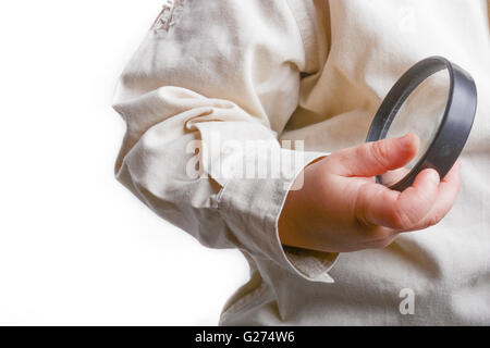 Baby holding a magnifying glass in hand on a white background Stock ...