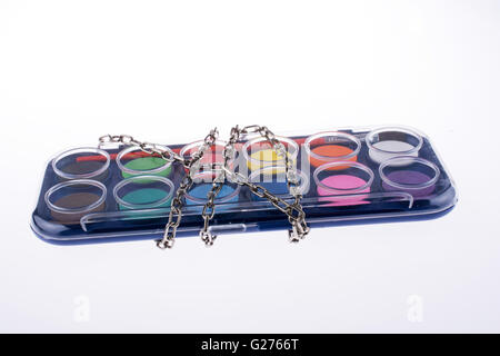 Watercolour paint set in chains on a white background Stock Photo - Alamy