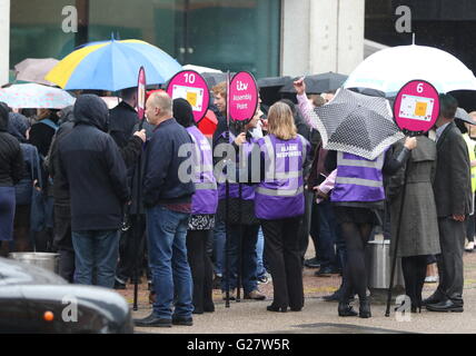 Staff leave the ITV studios following a fire drill on Monday afternoon ...