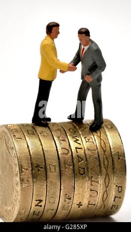 handshake Pound coins Stock Photo - Alamy