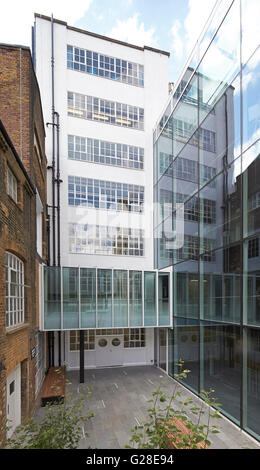 Courtyard with facade glazing and reflection. Heal's, Torrington Place ...