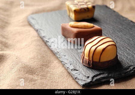 Front view sweet chocolate assortment dark board with copy space Stock ...