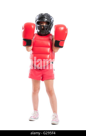 Young boxer girl acting angry or mad and wearing red boxing gloves ...