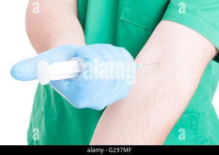 Man injecting with a syringe into own arm. On white background Stock ...