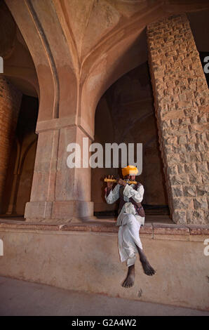 Indian man playing the flute, India Stock Photo - Alamy