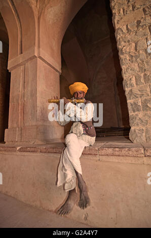 Indian man playing the flute, India Stock Photo - Alamy