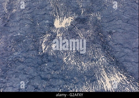 Tar texture with sand from a beach Stock Photo - Alamy