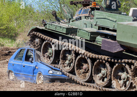military tank crushes a blue car Stock Photo - Alamy