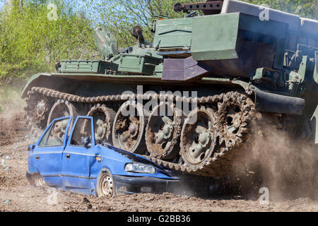 military tank crushes a blue car Stock Photo - Alamy
