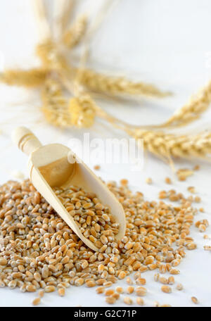 Wheat rye ears grains wooden spoon on wood board Stock Photo - Alamy