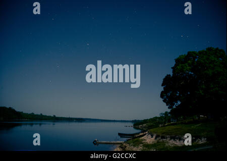 Full moon night in the Amazon forest along the Amazon river Stock Photo ...