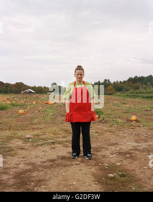 Female worker wearing apron Stock Photo - Alamy