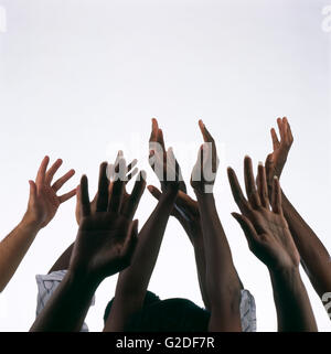 Group of People With Upraised Hands Stock Photo - Alamy