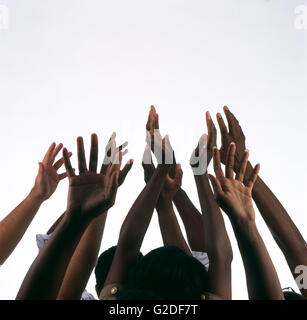 Group of People With Upraised Hands Stock Photo - Alamy