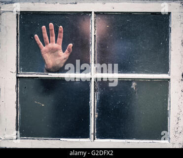 Young woman trapped against glass Stock Photo - Alamy
