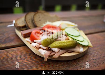 Jause with bread, ham and cheese served in an alpine chalet in Austria ...