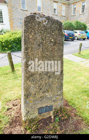 An old mile marker or stone used on road sides to indicate distances to ...